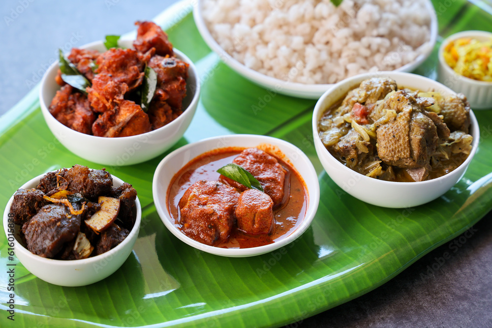 Kerala special food sadhya in banana leaf plate with Chicken fry Duck ...