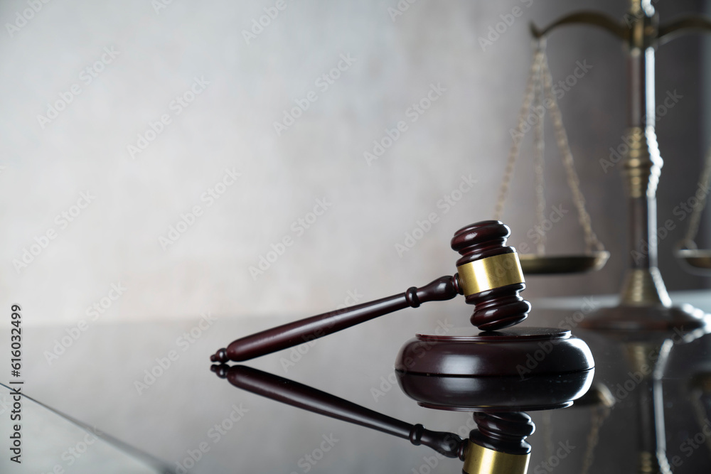 Law symbols composition. Gavel, scale and Themis sculpture on the gray ...