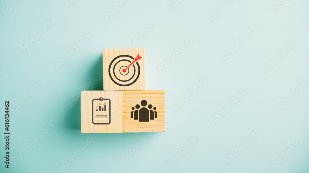 Wooden cube block step on a table with Action Plan, Goal, and Target ...