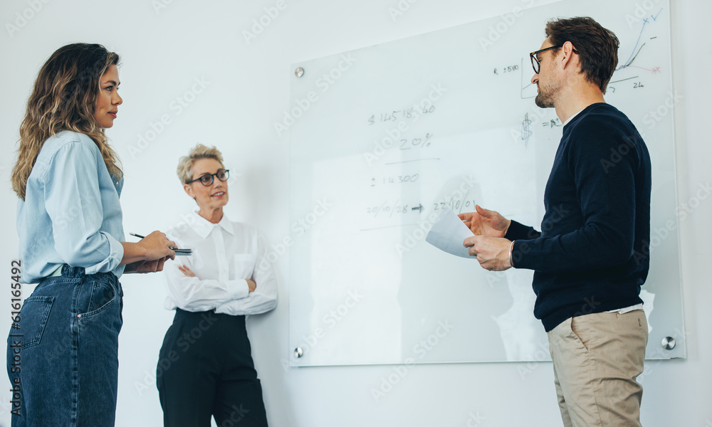 Group of financial professionals having a discussion in a business ...