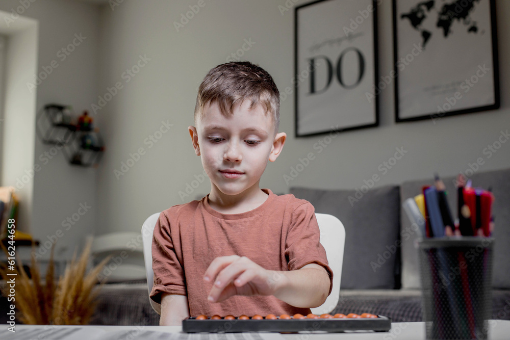 Little boy Counting with help an abacus. Mental arithmetic, brain ...