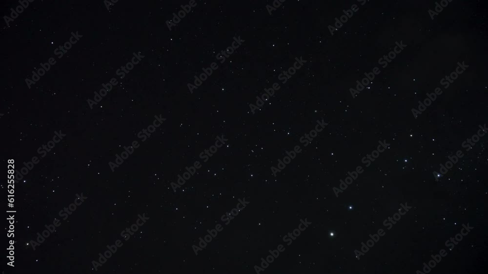 Night starry sky with bright stars with motion clouds and passing ...