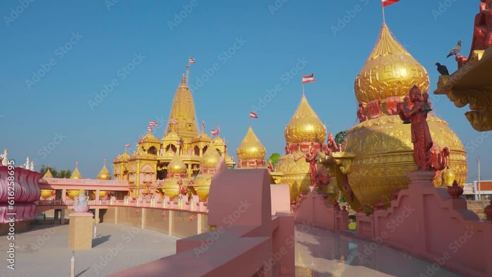Wide angle shot of beautiful golden Swaminarayan temple of ...