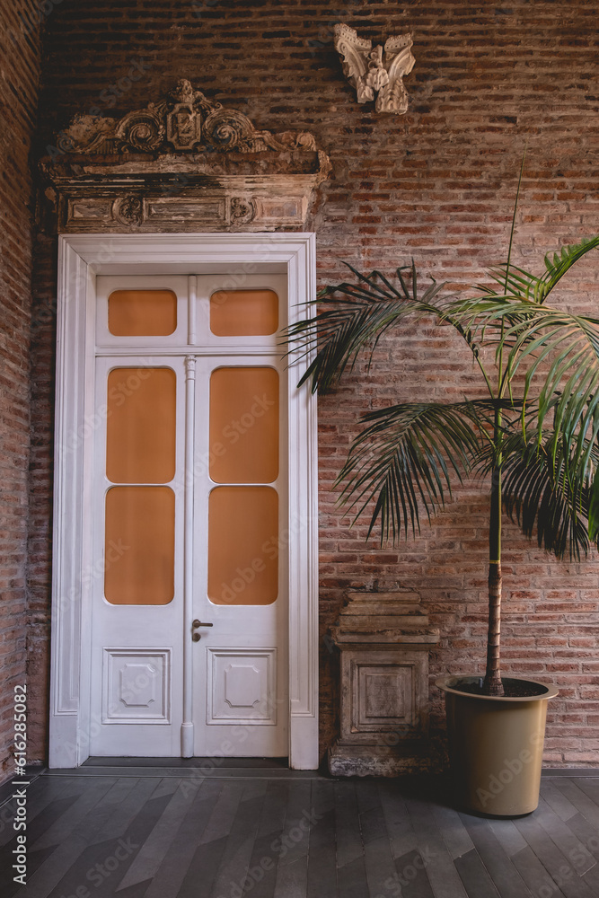 Elegant interior in a old centuries red brick palace with a big white ...
