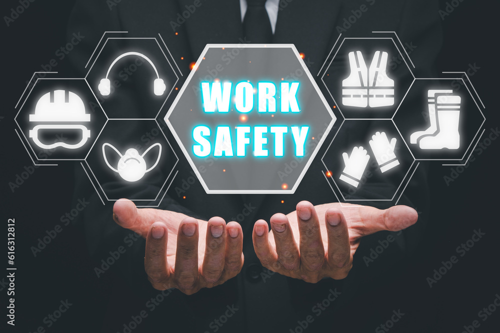 Work safety concept, Businessman hand holding holographic VR screen ...
