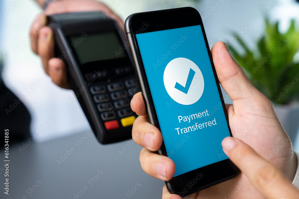 Hand holding smartphone with NFC QR code device, scanning contactless ...