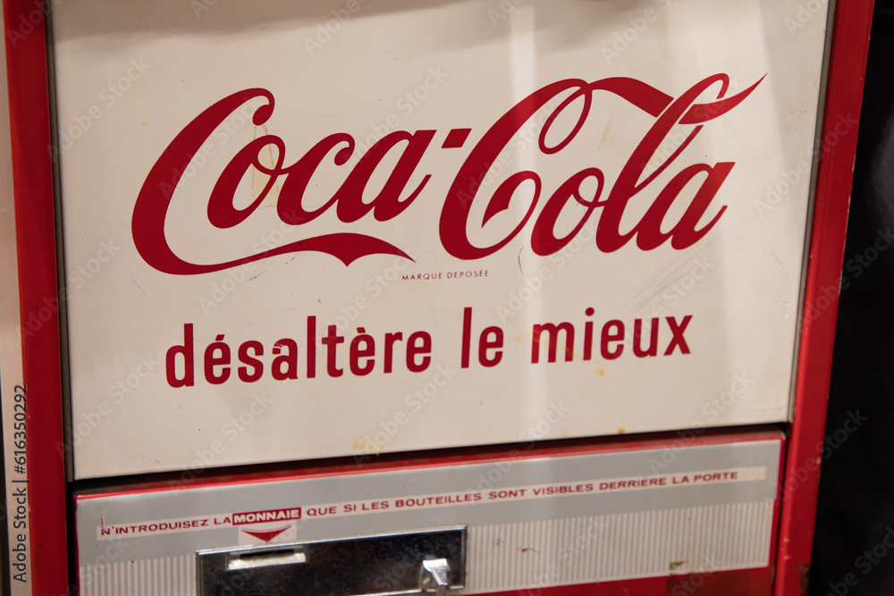 Coca Cola sign logo and red text brand on ancient french vending ...