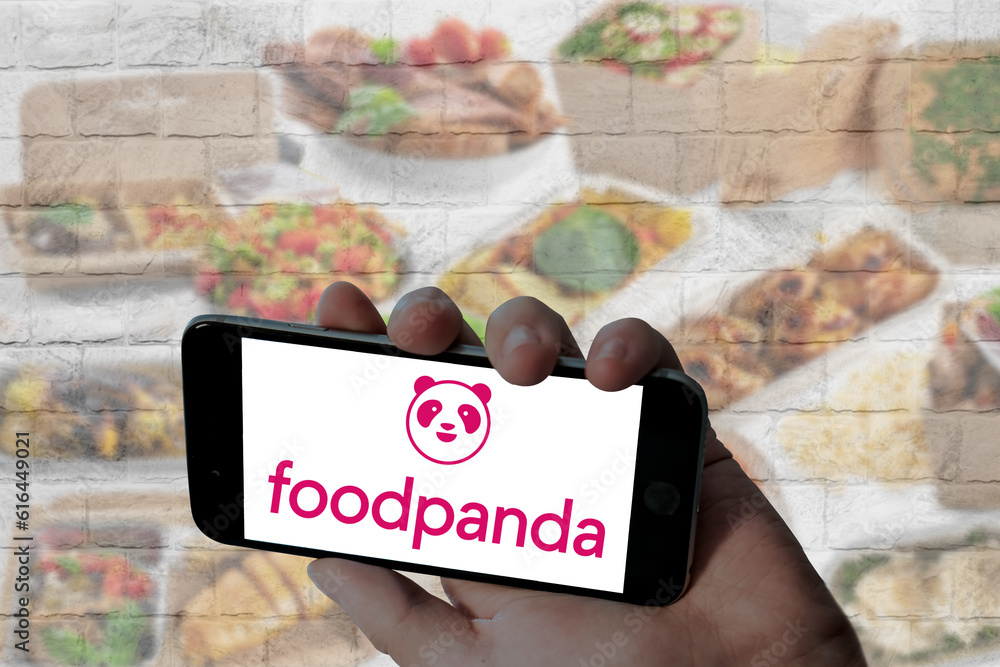 CHENNAI, INDIA 27TH JUNE 2023: Food Panda logo in holding mobile and ...