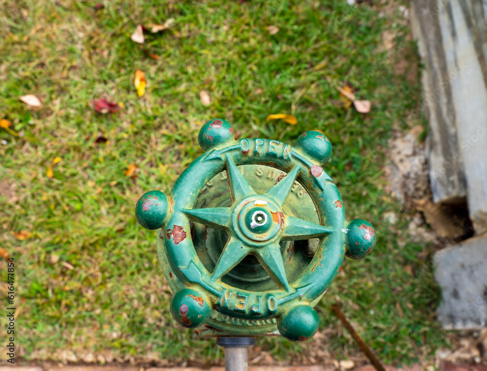 A vintage water lever and pipe. Water pipe was frequently made of cast ...