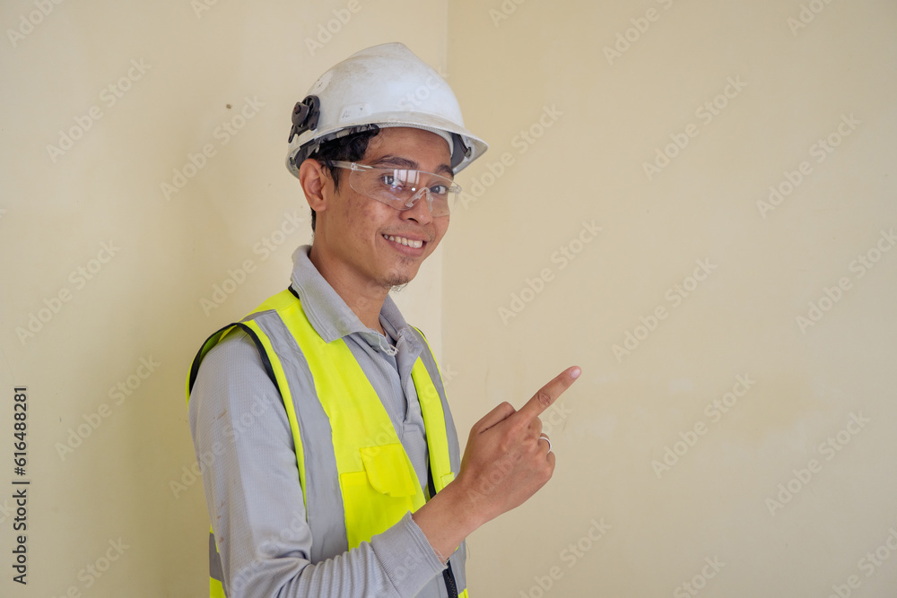 Young construction guys wear the wearpack and helmet show the click ...