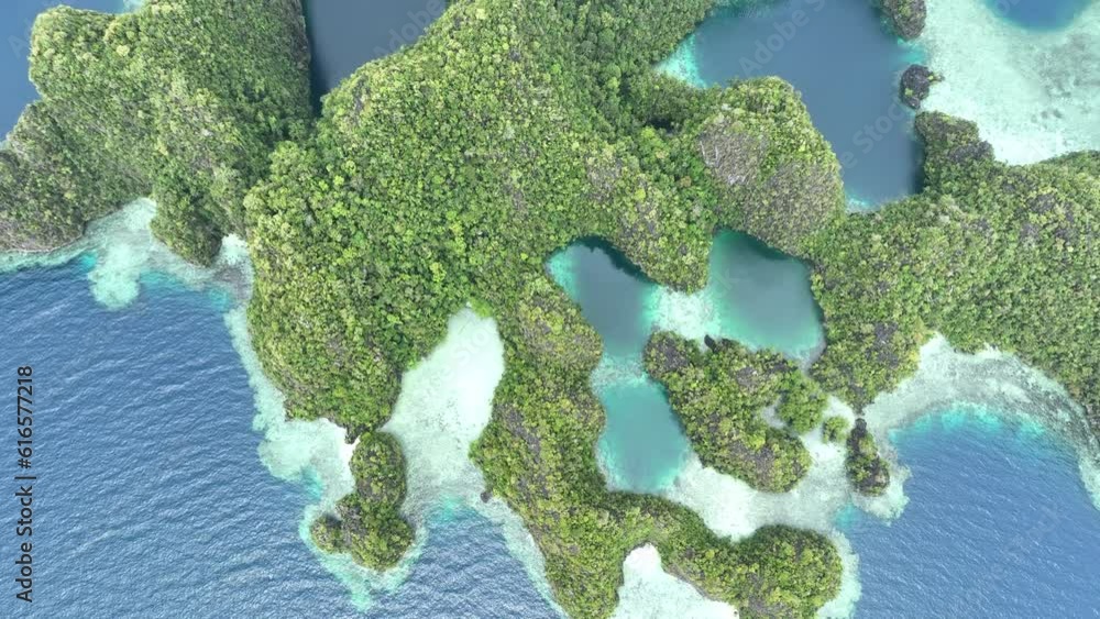 Rugged limestone islands, eroded over millions of years, rise from Raja ...