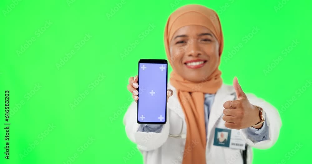 Muslim woman, doctor and thumbs up with phone mockup on green screen ...