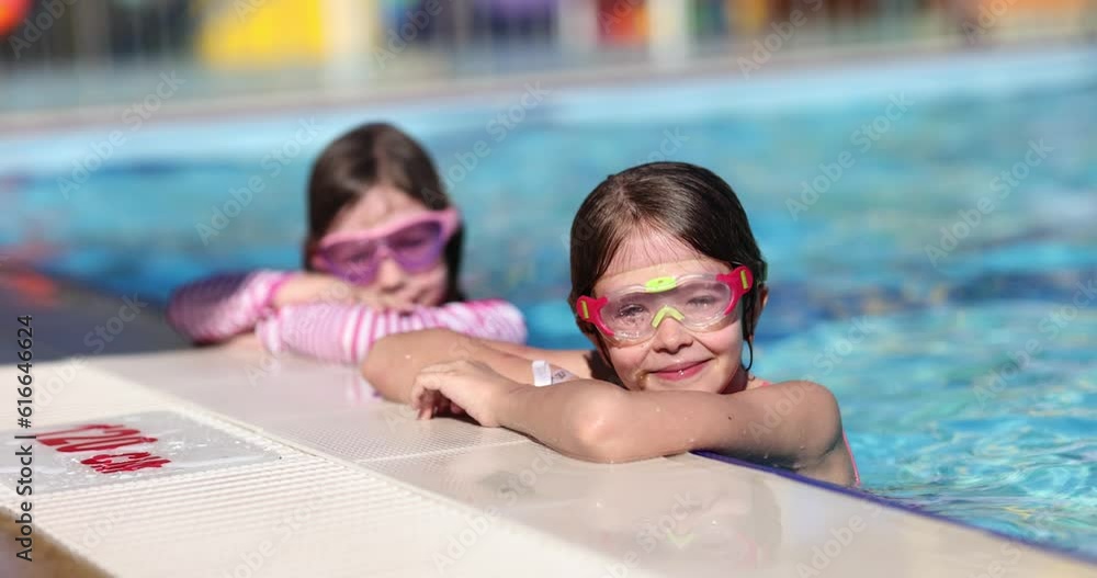 Cute Happy Little Girls Playing In Pool Wearing Pink Glasses Mask
