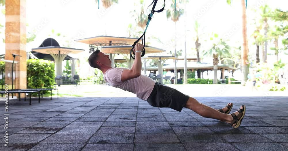 Muscular athletic powerful bodybuilder, athlete using sports equipment ...