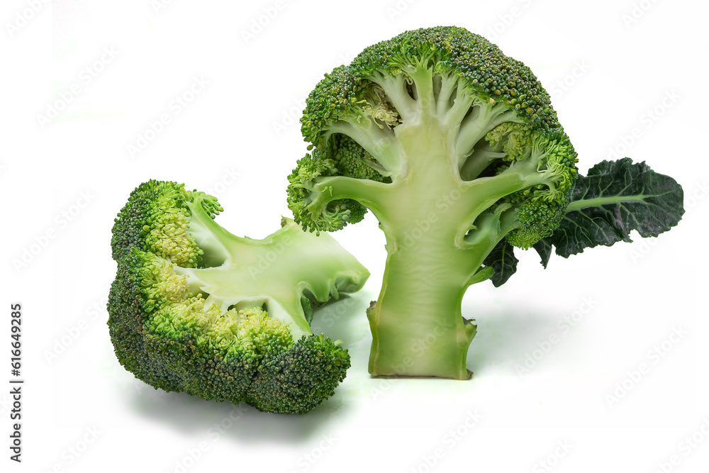 2 half cutted separate small broccoli isolated on white background as ...