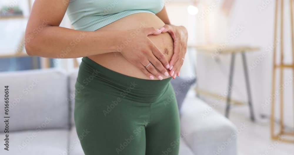 Vidéo Stock Pregnant woman, stomach rubbing and hands in home with baby ...