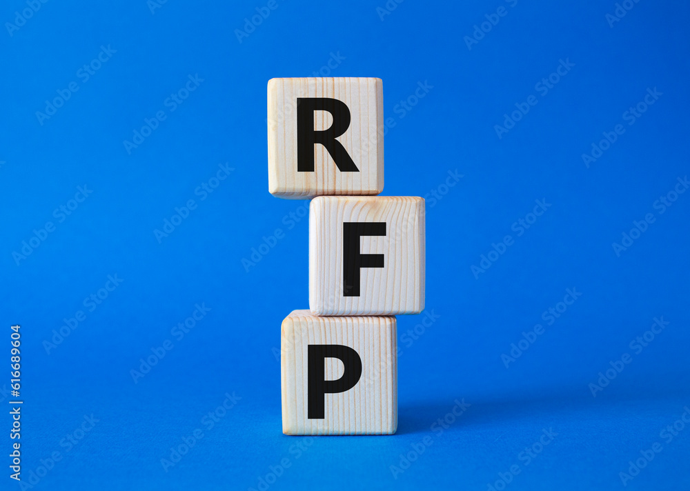 RFP - Request for Proposal. Wooden cubes with word RFP. Beautiful blue ...