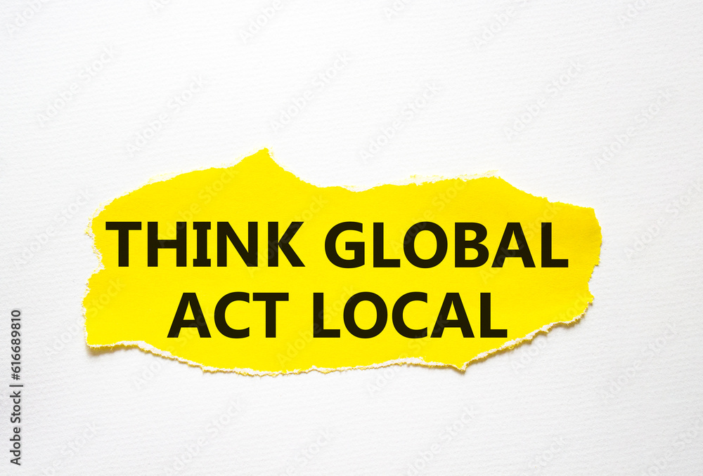 Think global act local symbol. Torn yellow paper with words Think ...
