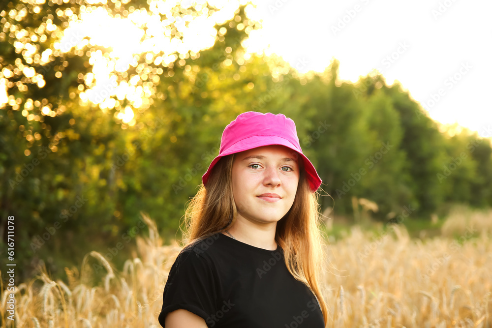 A cheerful teenage girl, aged 12 or 13, stands gracefully in a vibrant ...