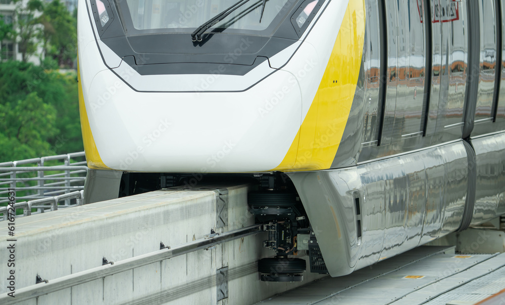 Elevated monorail train on rail. Guide wheels rubber tire on concrete ...