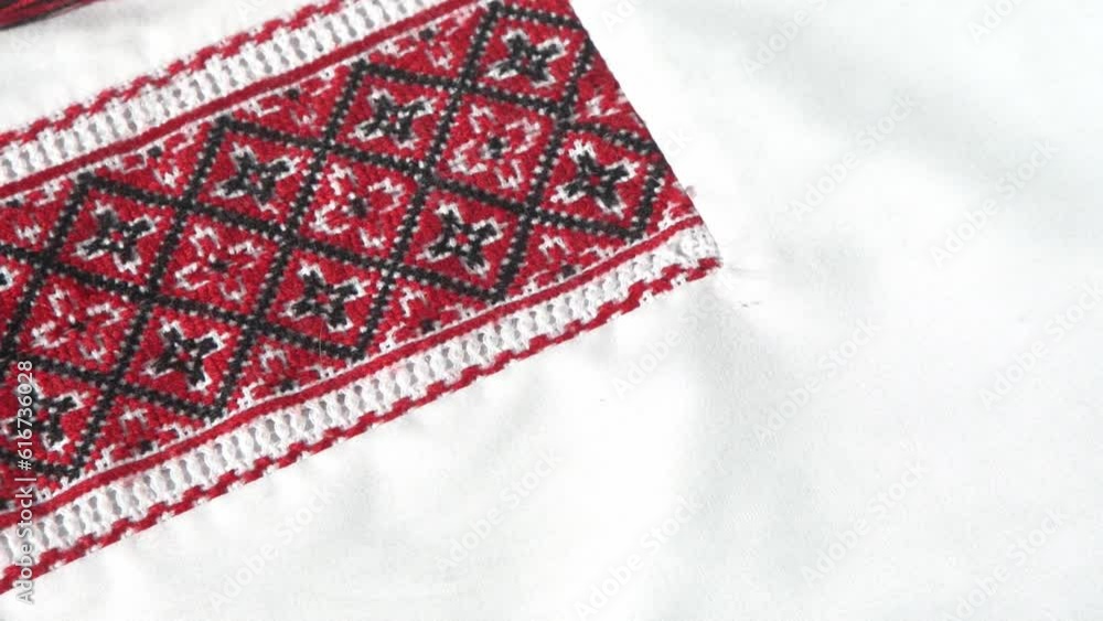Ukrainian clothes embroidered shirt. Red and black threads background ...