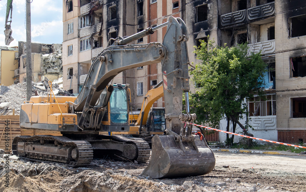 Construction work on the demolition of multi-storey apartments. Fence ...