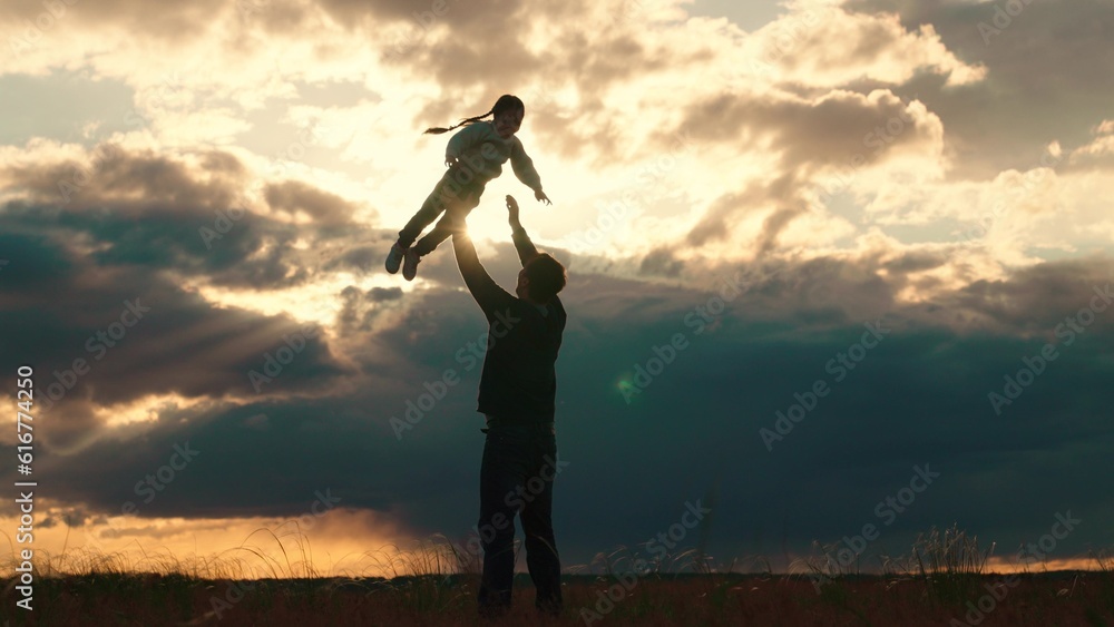 Concept, family safety trust, Dad plays with his daughter, throws child ...