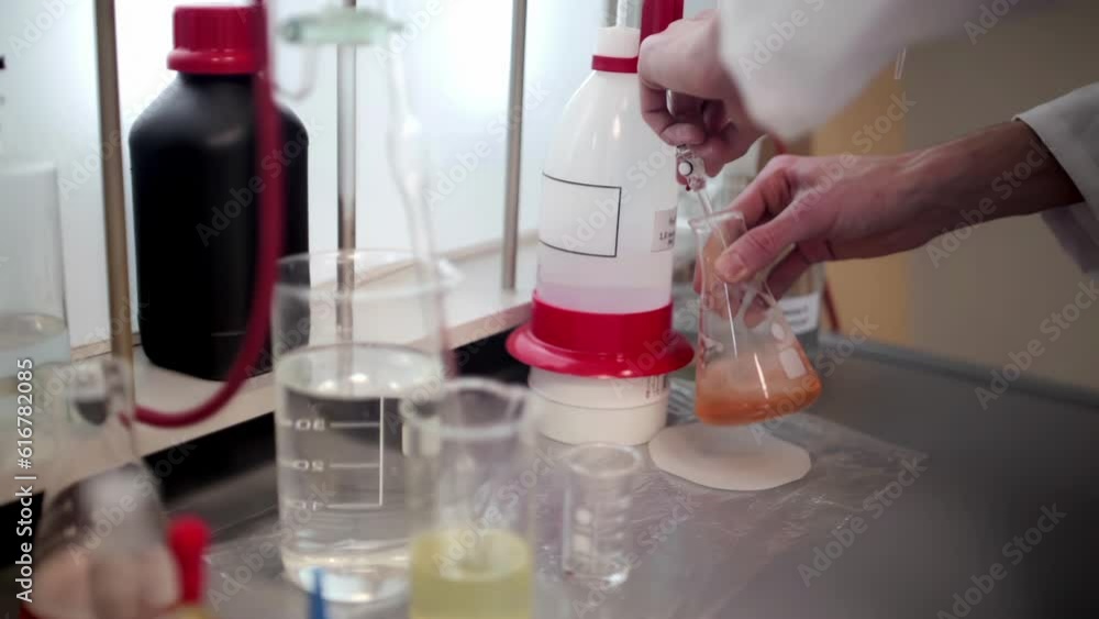 Witness a captivating laboratory chemical reaction as a flask solution ...