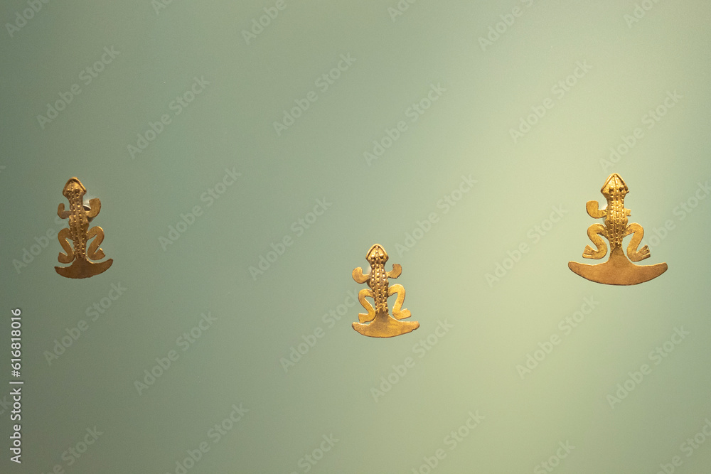 BOGOTA, COLOMBIA Closeup to a golden tadpole golden figure into golden ...