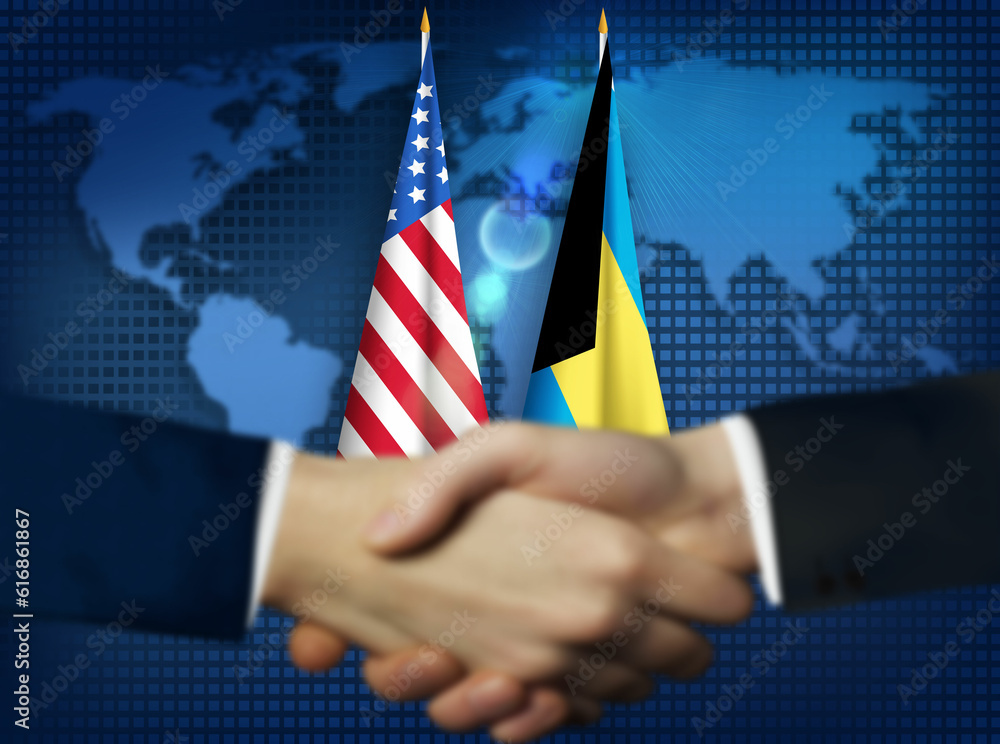 Two person shaking hands in front American,Bahamas flags.Bahamas,US ...