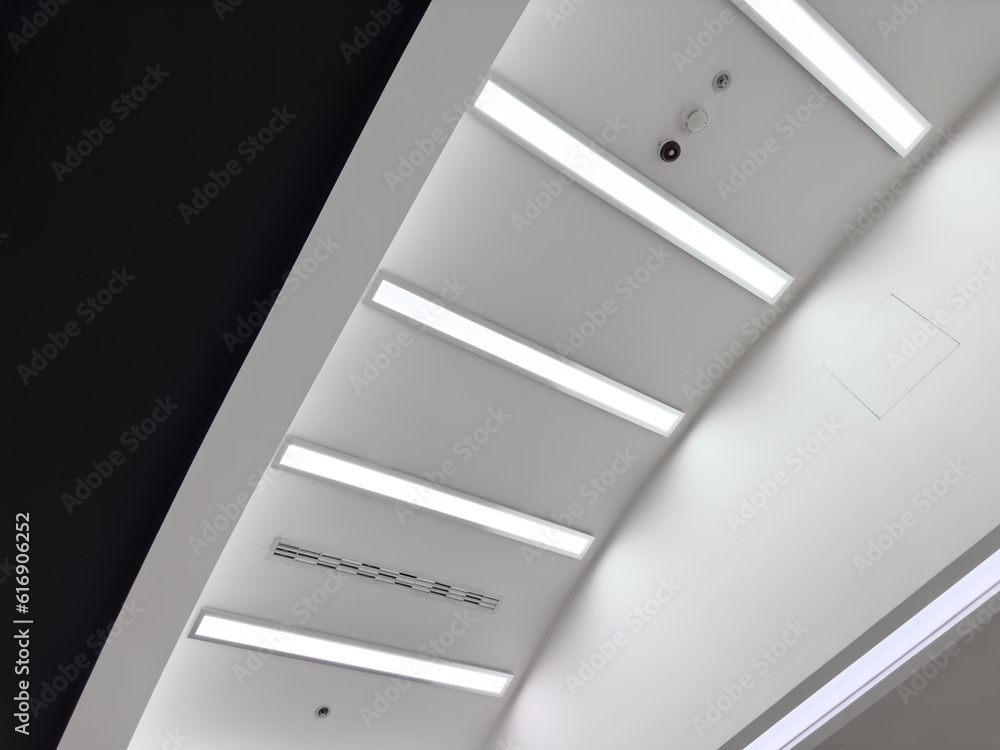 Lights and ventilation system in long line on ceiling of the industrial ...
