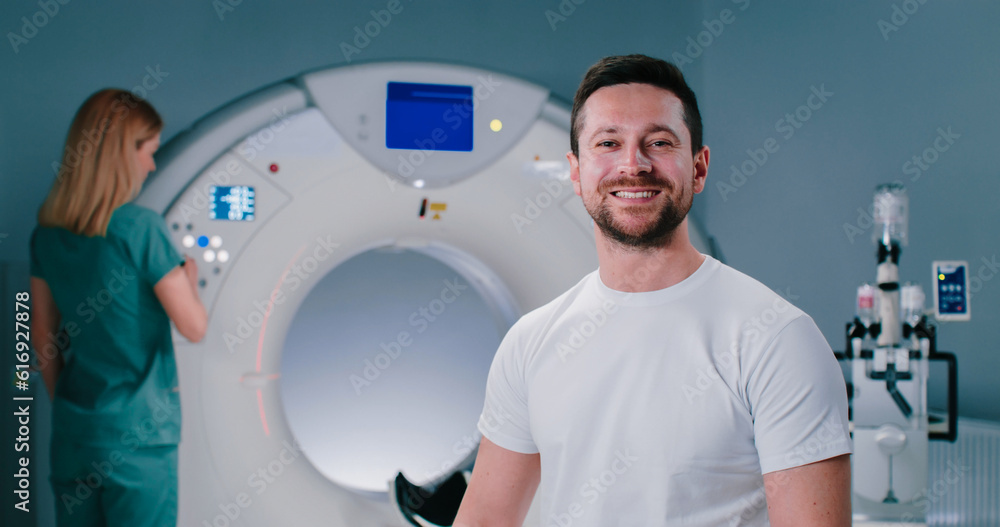 Happy male patient at well-equipped MRI laboratory, Portrait of ...