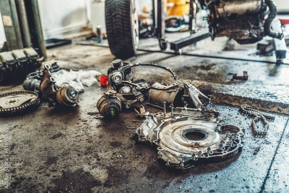 disassemble the engine from the car in the car workshop. Stock Photo ...