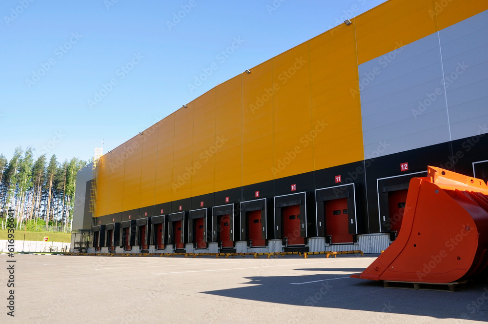 Large distribution warehouse with gates for loading goods. Storage ...