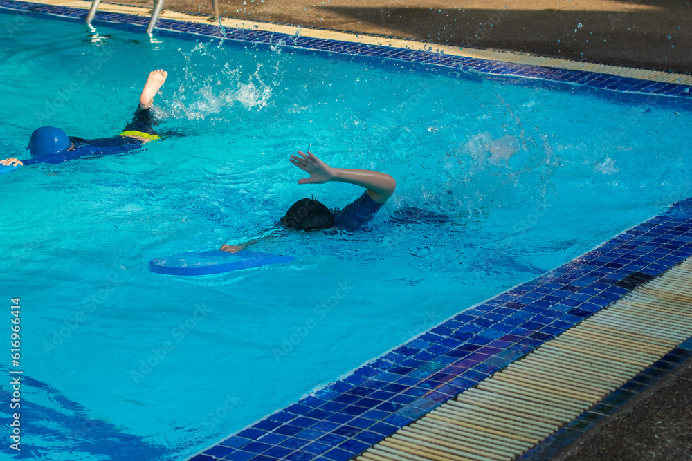 Asian young boys who a swimmer wearing dark blue suit. Black hair child ...