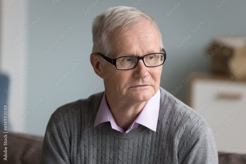 Head shot portrait of concerned gloomy serious mature man in glasses ...