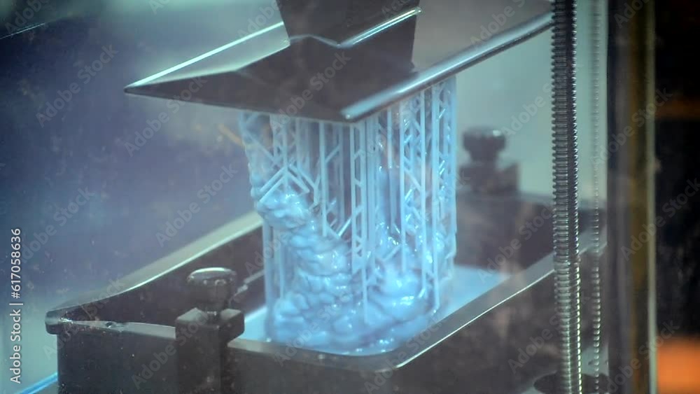 Working of photopolymer sla 3D printer. Platform with building object ...