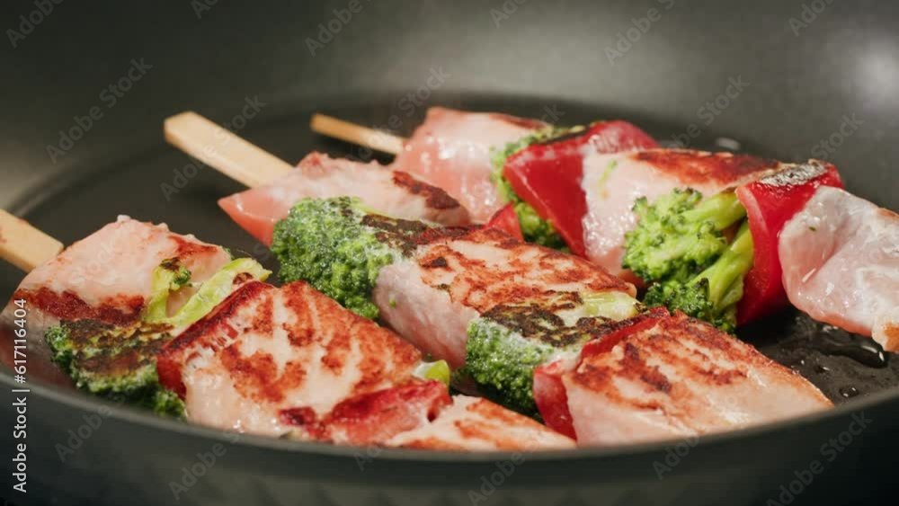 Chef cooking on pan fish tuna salmon grilled tapas skewer from vacuum ...