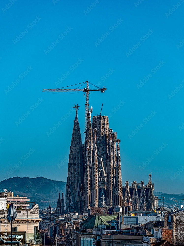 Sagrada Família looming over the city is one of Barcelona landmarks ...