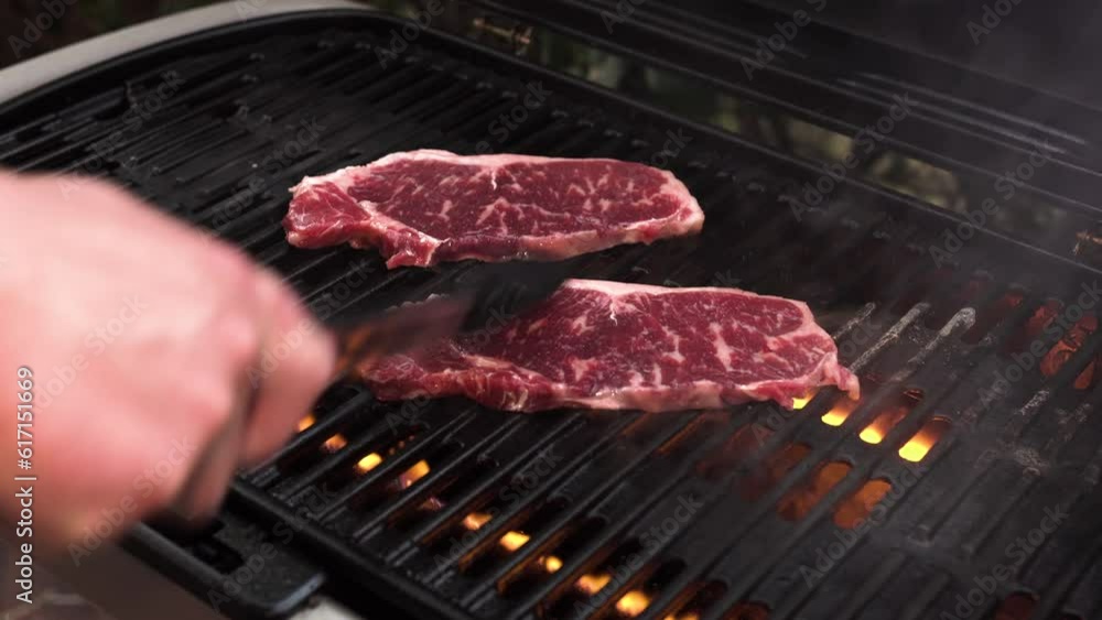 Searing And Flipping Ribeye Steaks On Grill Ribs On Flaming Grill Barbecued Barbecue Meat On