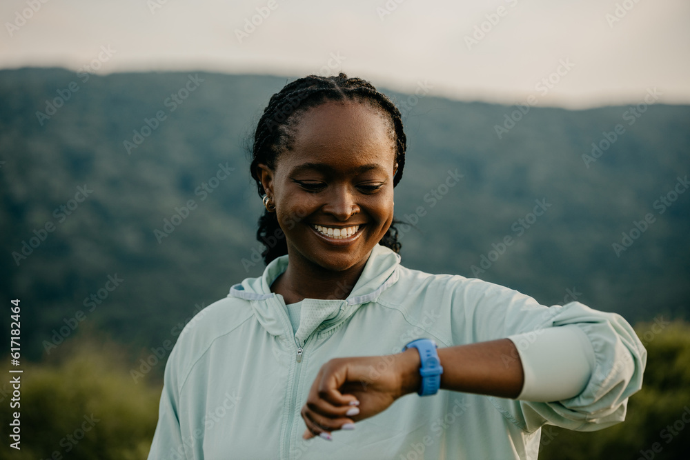 Fitness Tracking in Motion: a black jogger effortlessly glides along a ...