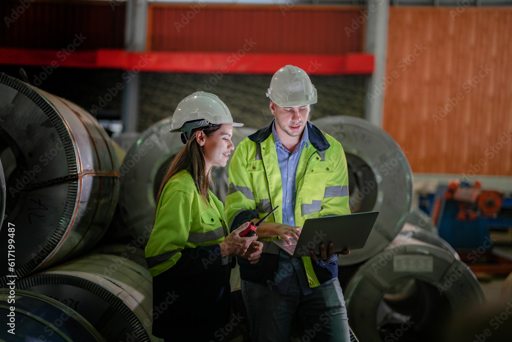 Professional engineering workers walk and check in warehouse factory ...