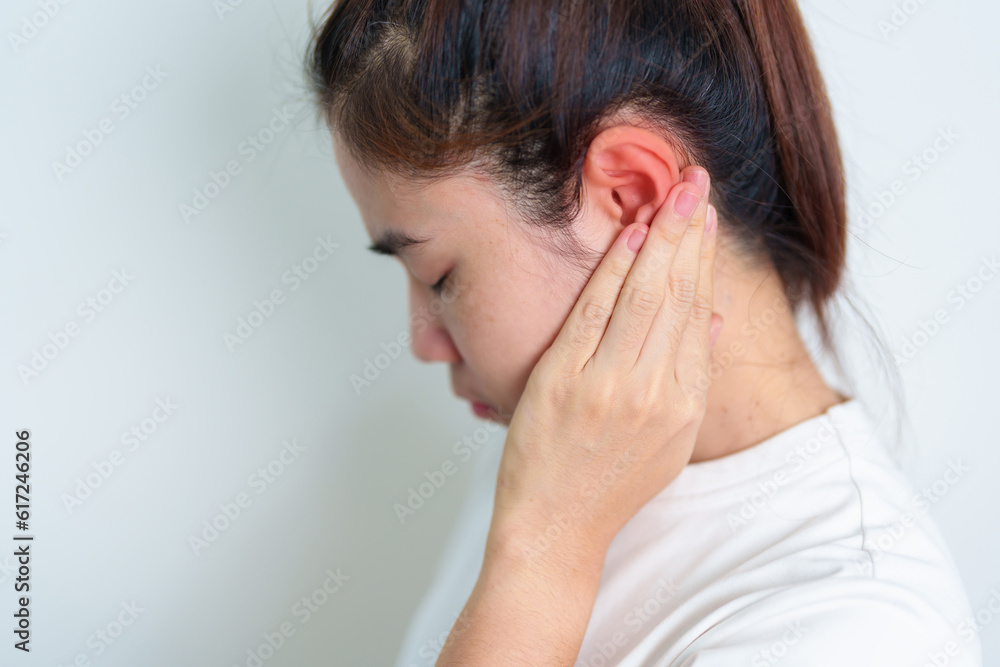 Woman holding her painful Ear. Ear disease, Atresia, Otitis Media ...