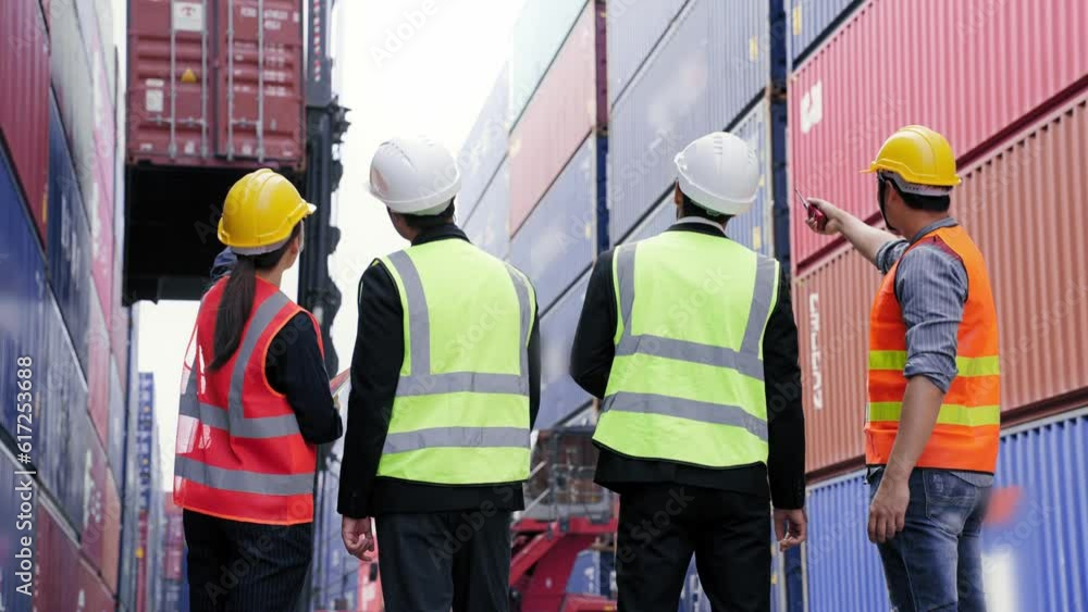 Labor group and workers standing and looking at the forklift in ...