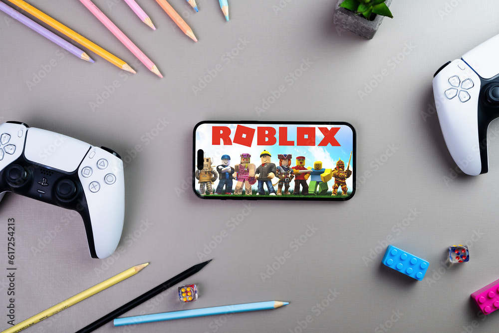 Roblox game app on the smartphone iPhone 14 Pro screen on gray table ...