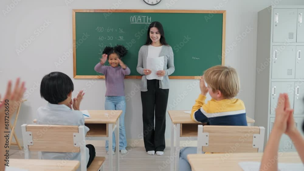 Smart student girl writing answer the teacher questions in mathematics ...