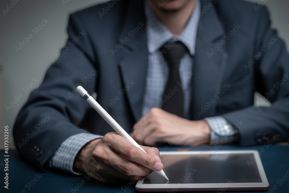 Businessman writes signing contract, designs, draws, or sketches ...