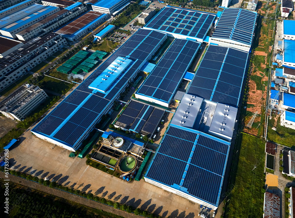 Aerial photography of solar photovoltaic panels built on the roof of a ...
