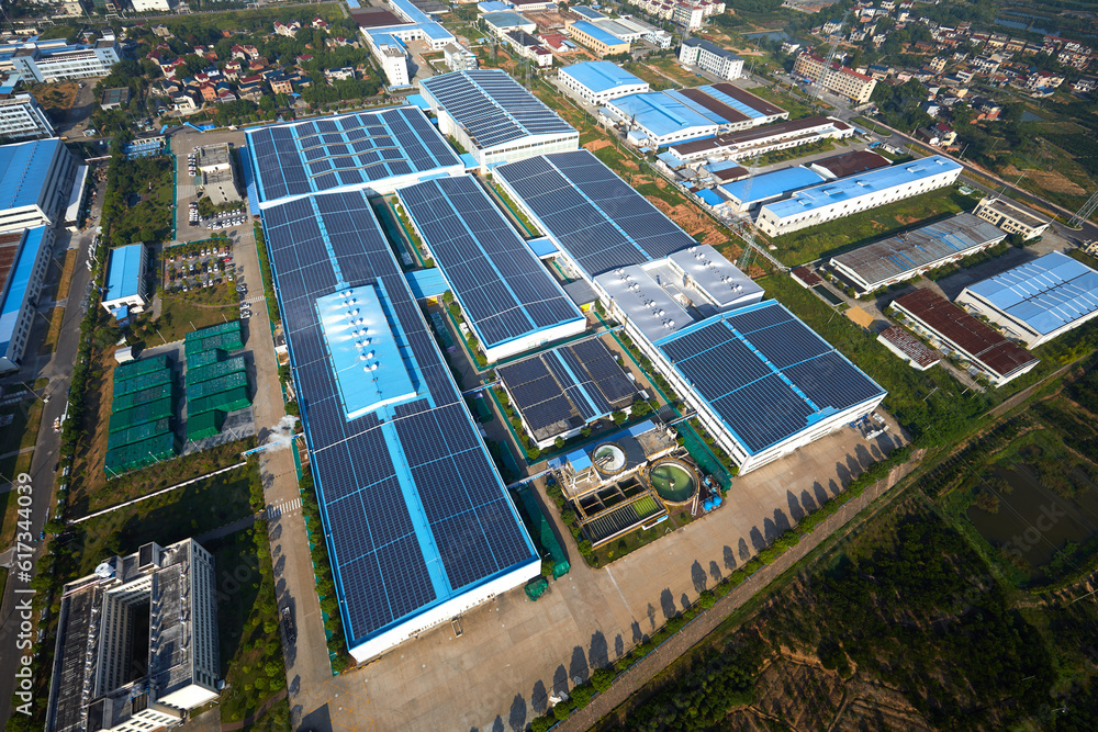Aerial photography of solar photovoltaic panels built on the roof of a ...
