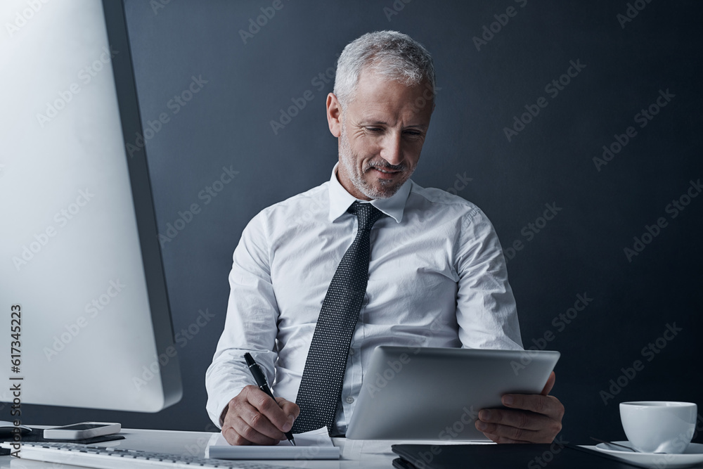 Ceo, tablet and mature man writing in studio isolated on a dark ...